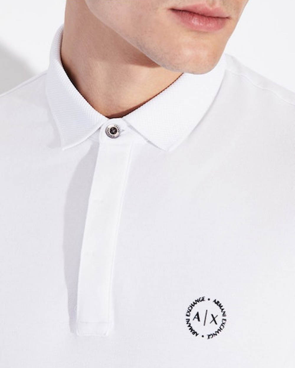 Polo bianca mezza manica in cotone stretch con abbottonatura coperta ...