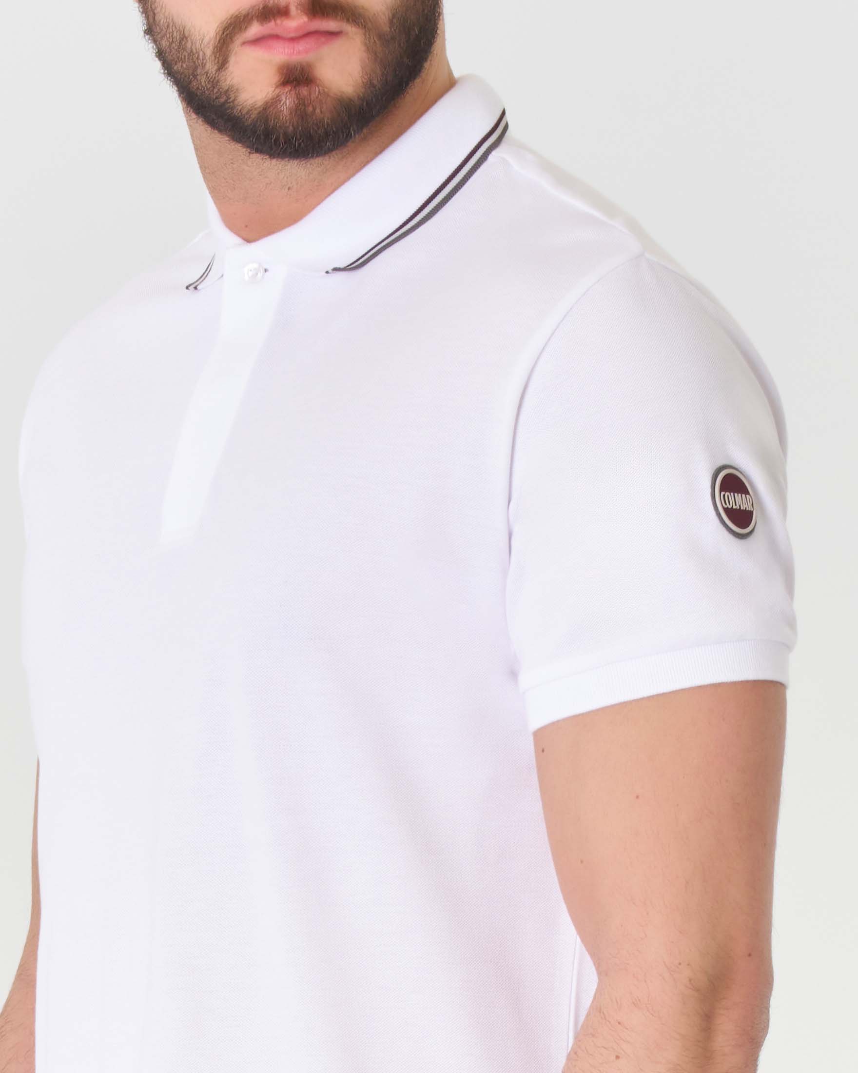 Polo bianca mezza manica in piquè con abbottonatura coperta e bordino ...